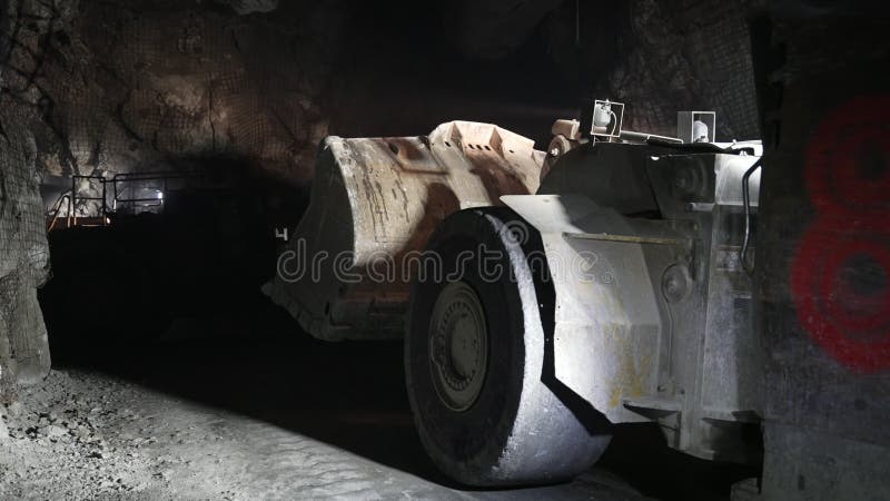 Underground Truck Loaded with Ore Rides in an Underground Mine Stock ...