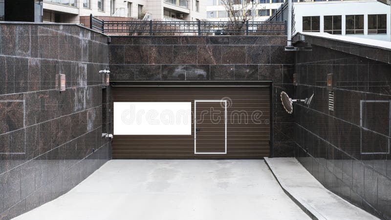 Underground Parking Entrance with Brown Garage Door Featuring Blank ...