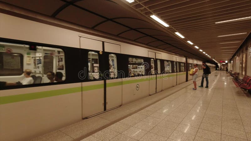 Underground Train Arriving at the Tube Station Platform at District and ...