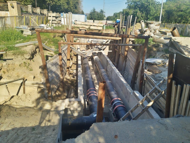 Underground Utility Installation: Active Construction Site with Large ...