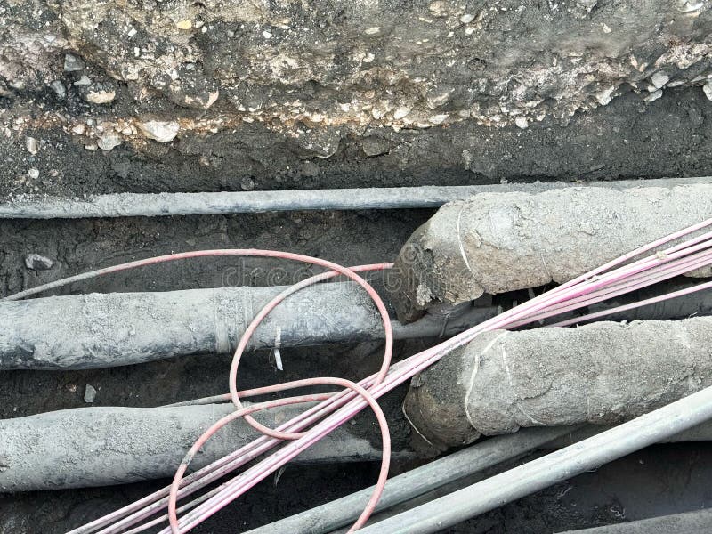Underground Utility Installation with Exposed Cables in Construction ...