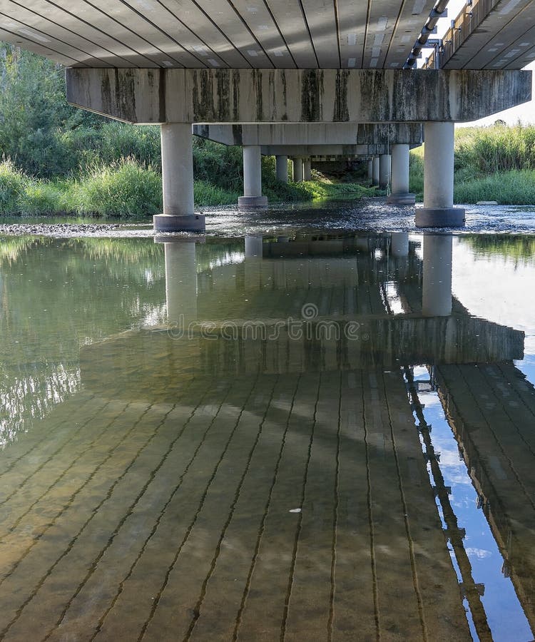 Underside of Concrete Bridge Over a Creek Stock Photo - Image of ...