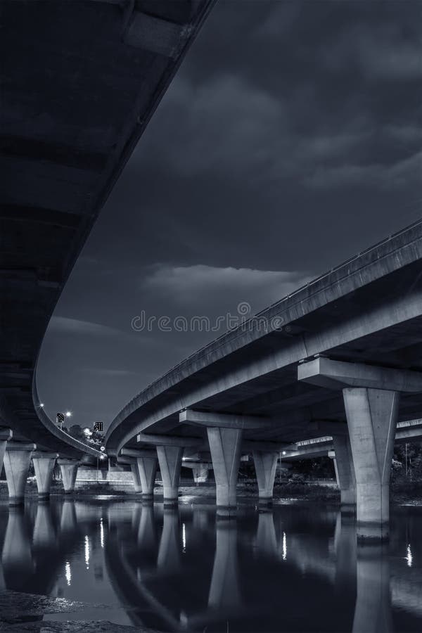 Underside of an Elevated Road Across River at Night Stock Illustration ...