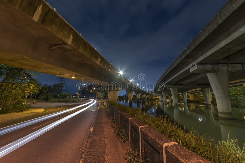 Underside of an Elevated Road Across River at Night Stock Image - Image ...