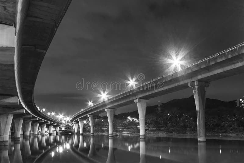 Underside of an Elevated Road Across River at Night Stock Photo - Image ...