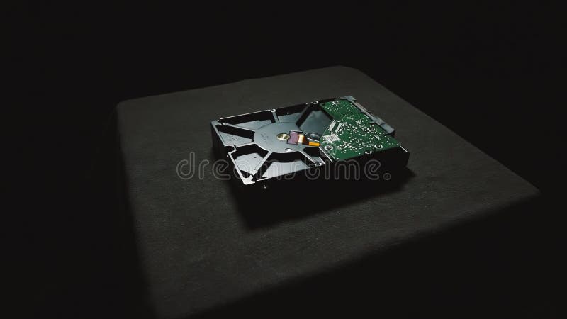 The Underside of an Hard Disk Drive in Dark Room on Textile Surface ...