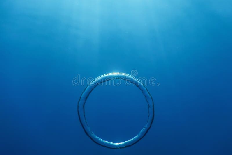 Underwater Bubble Ring Ascends Stock Photo - Image of abstract, aquatic ...