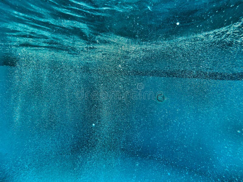 Underwater bubbles in pool stock photo. Image of pool - 79674260