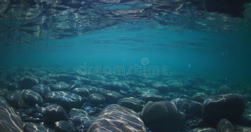 Underwater Ocean with Stones Bottom, Reflection and Blue Water. Stock ...