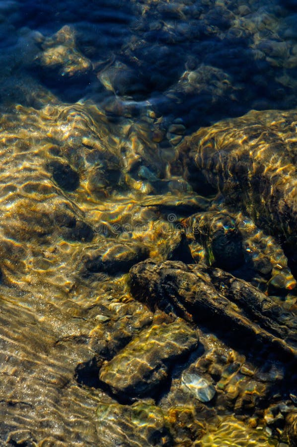 Underwater Reflection of Sand, Rocks and Stones Underneath Stock Photo ...