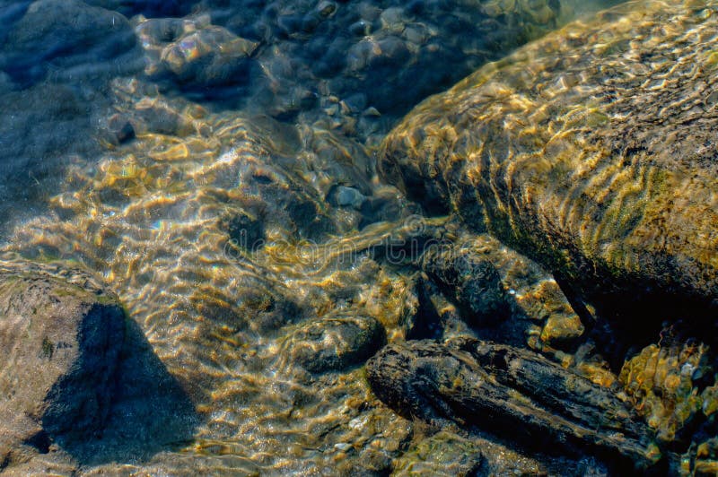 Underwater Reflection of Sand, Rocks and Stones Underneath Stock Photo ...