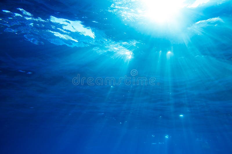 Underwater Shot with Sun Rays in Deep Blue Sea Stock Photo - Image of ...