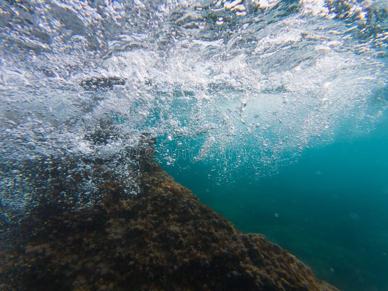 Underwater Shot of a Wave Breaking on Rocks in the French Riviera Stock ...