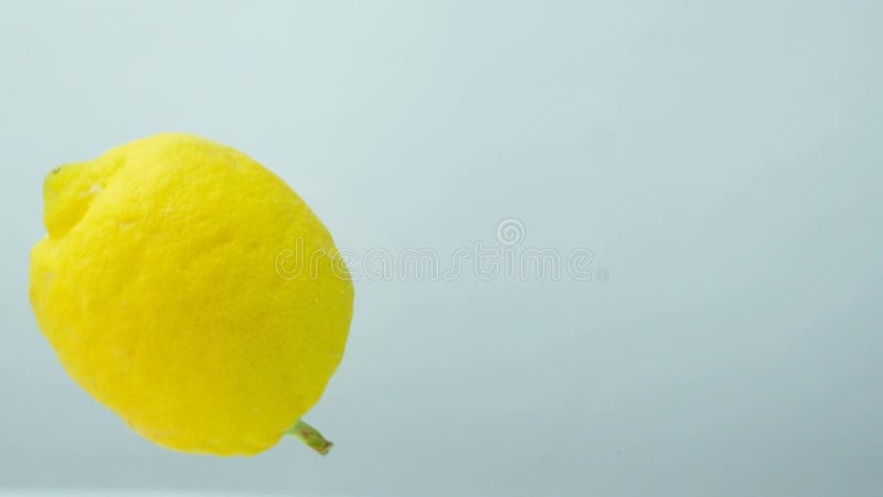 Underwater View of Fresh Whole Lemon with Tiny Bubbles Stock Video ...