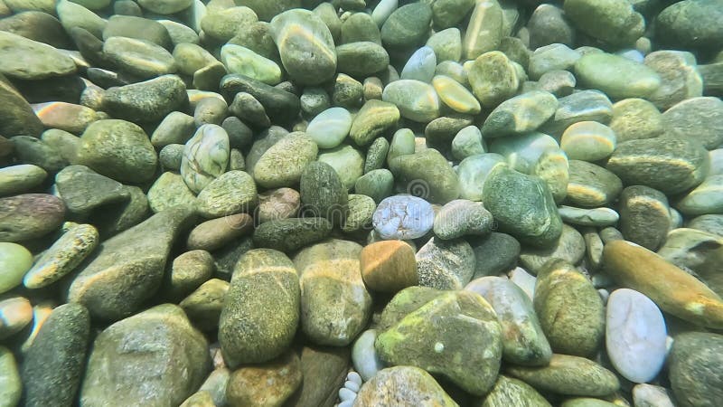 Underwater View with Stones Bottom, Sun Rays and Reflection in Sea ...