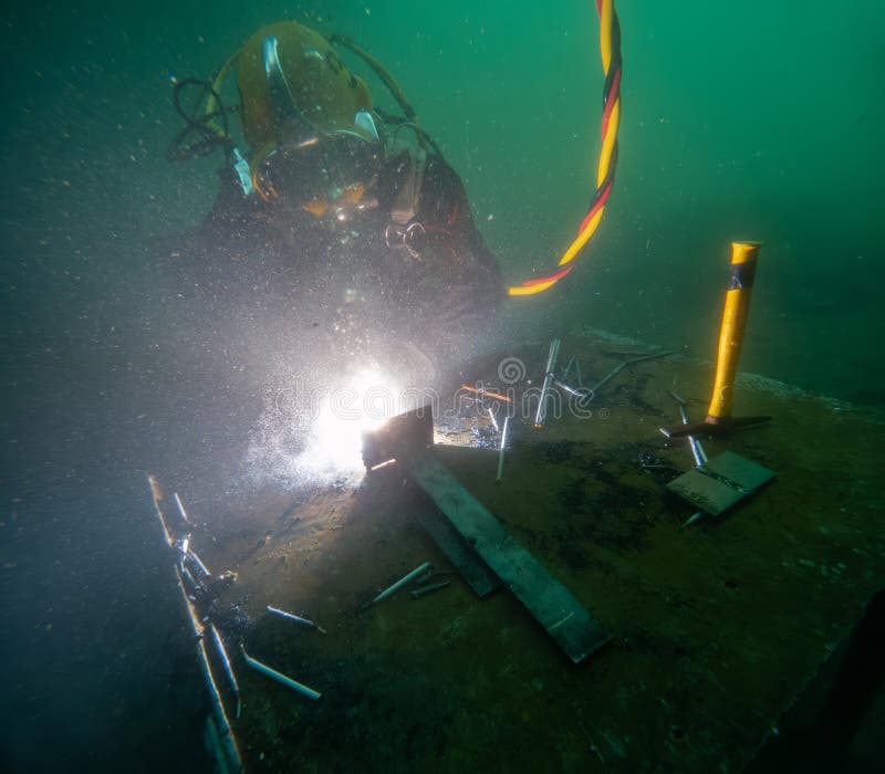 Underwater Welding in Deep Ocean Depths Stock Image - Image of flame ...