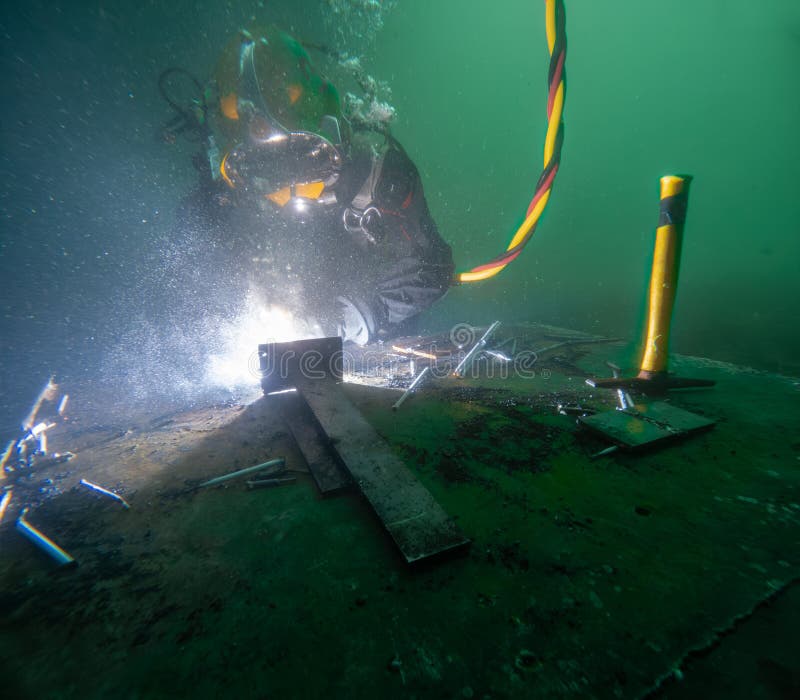 Underwater Welding in Deep Ocean Depths Stock Photo - Image of dark ...