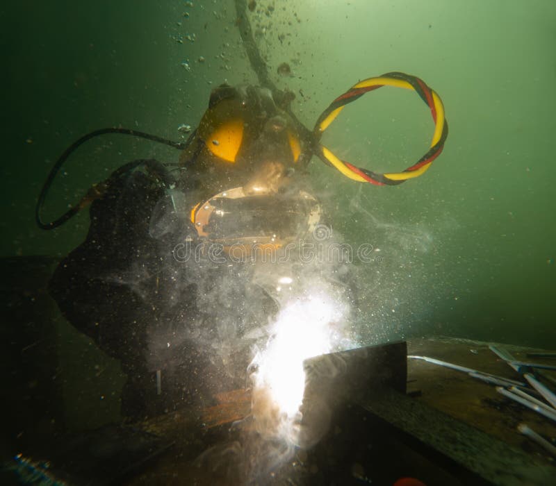 Underwater Welding in Deep Ocean Depths Stock Photo - Image of helmet ...