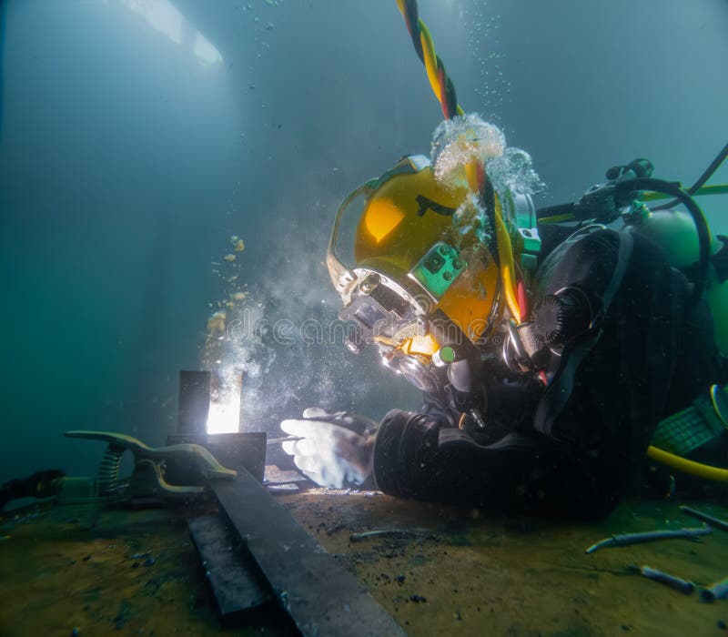 Underwater Welding in Action with Sparks Flying and Bubbles Rising ...