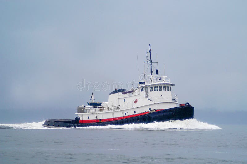 Tug Boat Making Way stock image. Image of water, commerce - 110106175