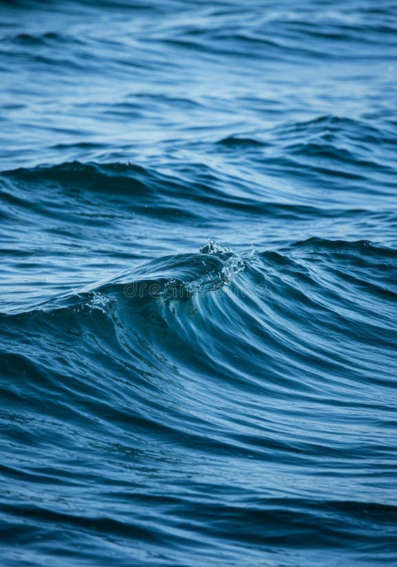 Undulating Ocean Waves with Varying Shades of Deep Blue Create a ...