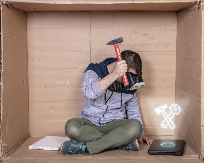 Unemployed Boy Wearing VR Glasses with a Hammer in His Hand Stock Photo ...