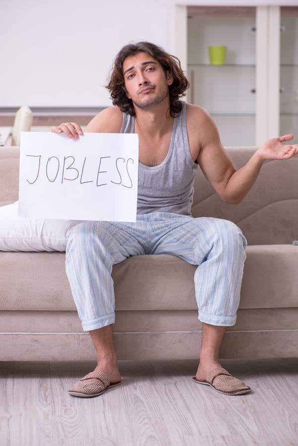 Unemployed Man Desperate at Home Stock Photo - Image of holding, fired ...