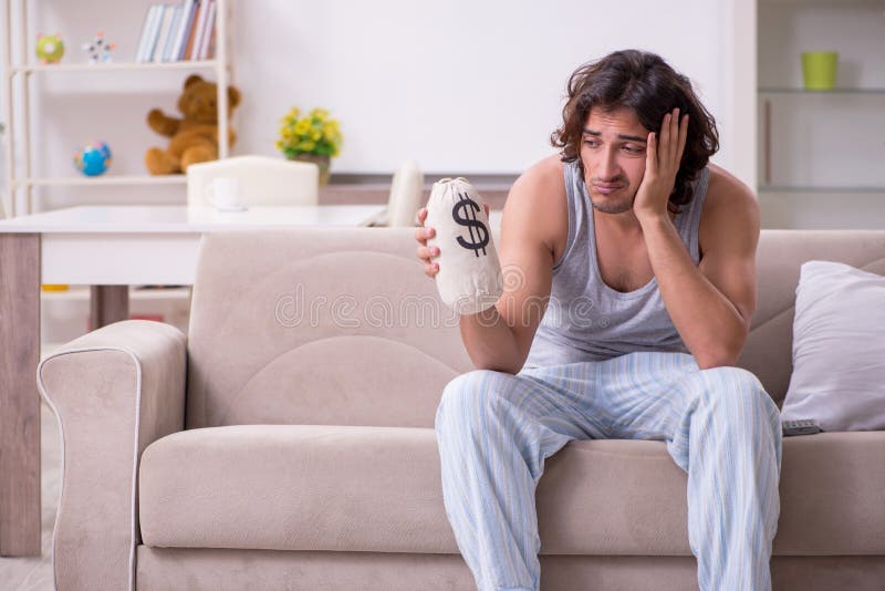 Unemployed Man Desperate at Home Stock Photo - Image of holding, fired ...