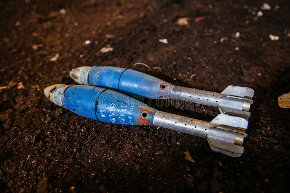 Unexploded Mortar Mines on Ground. War Actions Aftermath Stock Image ...