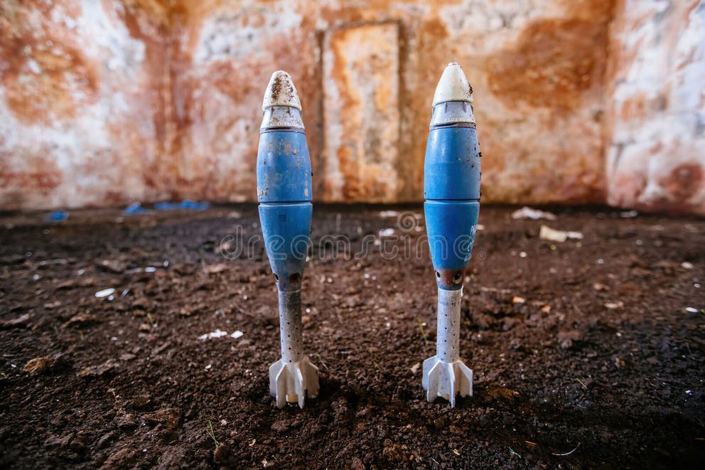 Unexploded Mortar Mines on Ground. War Actions Aftermath Stock Image ...