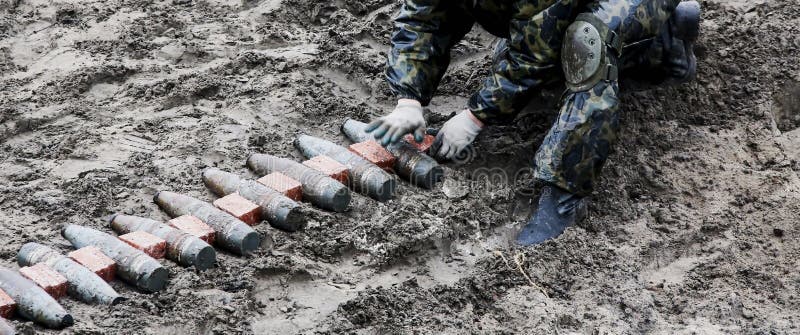 Clearing of Unexploded Ordnance after a Battle in a War, Undermining ...