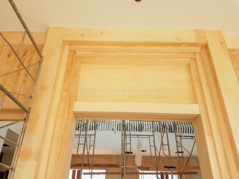 Unfinish Wooden Door Frame with Architrave. Modern Interior Stock Image ...