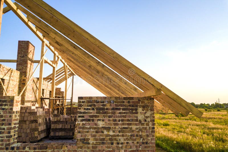 Unfinished Brick House with Wooden Roof Structure Under Construction ...