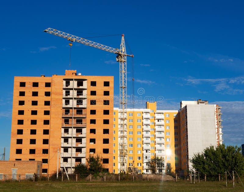 Unfinished Brick Multistory Building with Crane on the Construction ...