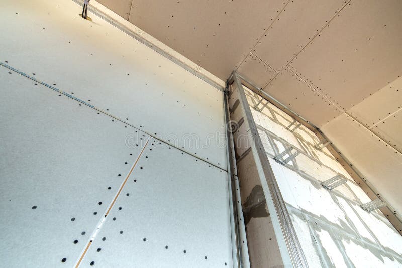 Unfinished Brick Wall in a Room Under Construction Prepared for Drywall ...