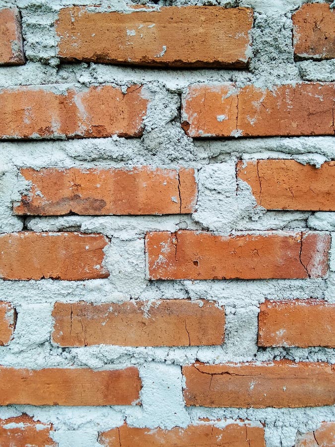 An Unfinished Building Wall, the Bricks and Cement are Still Visible.a ...