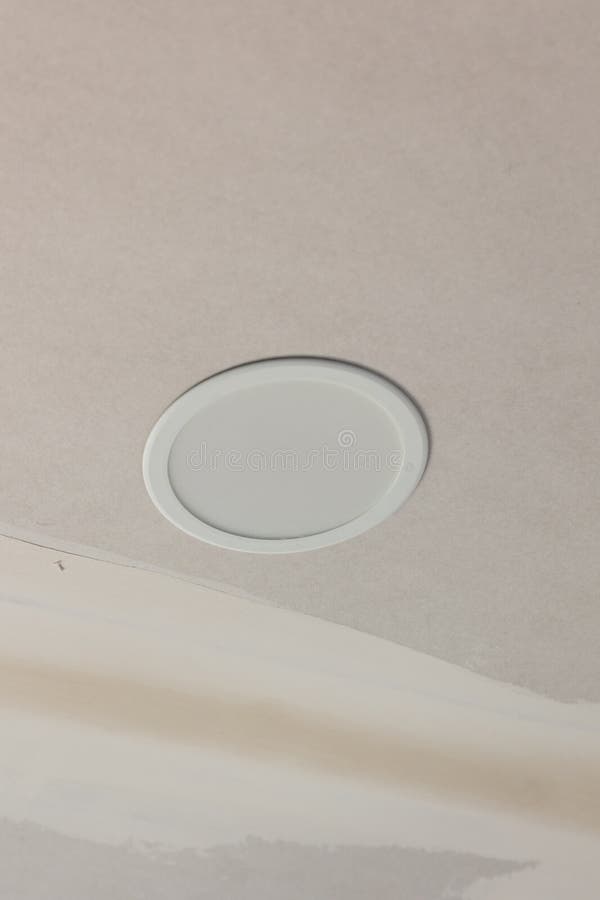 An Unfinished Ceiling with Visible Drywall and Recessed Light ...