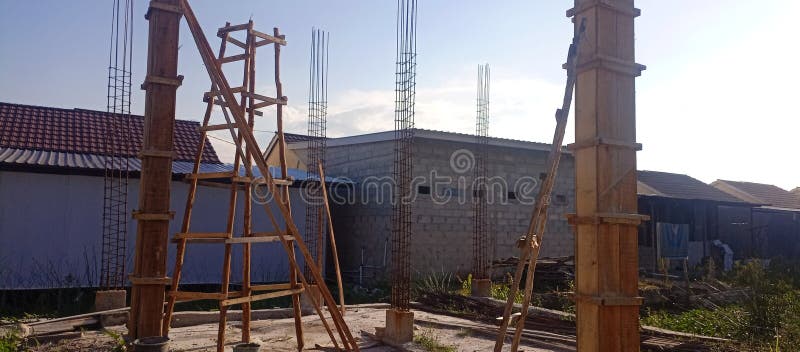 Unfinished Construction of the House Pole Building Stock Image - Image ...