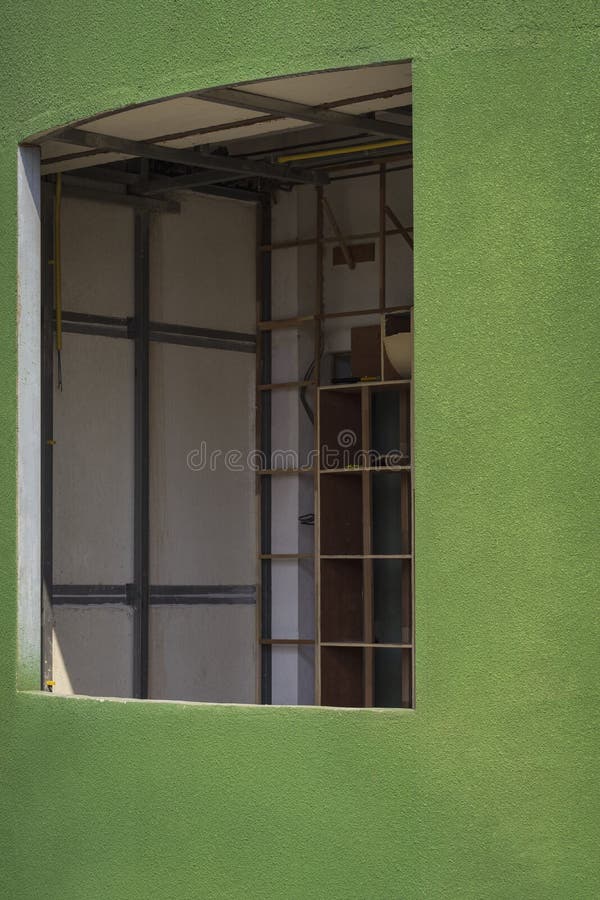 The Unfinished Interior Wall in Window Frames on Curve Green Concrete ...