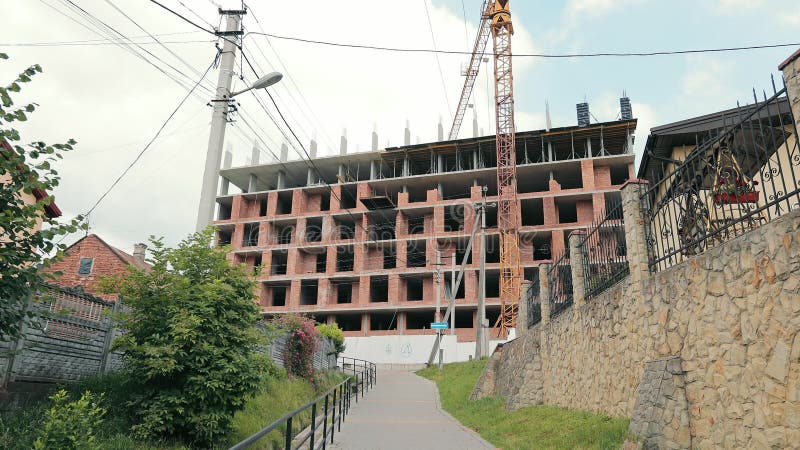 An Unfinished Multi-story Brick Building that is Under Construction ...