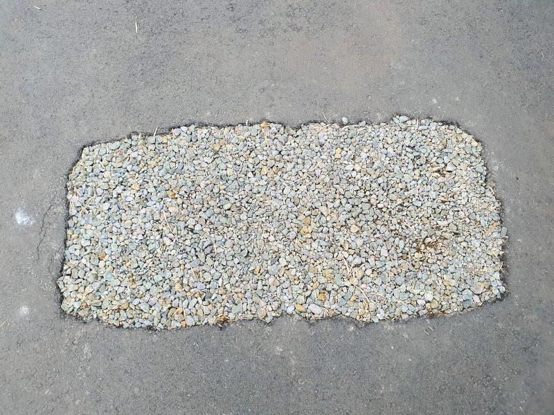 An Unfinished Patch of Asphalt Road Stock Image - Image of textured ...