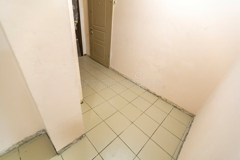Unfinished Renovation of a Tile Floor in a Building Stock Image - Image ...