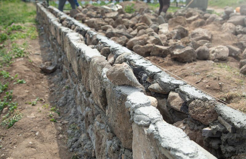 Unfinished Rough Stone Wall in Outdoor. Construction Stock Photo ...