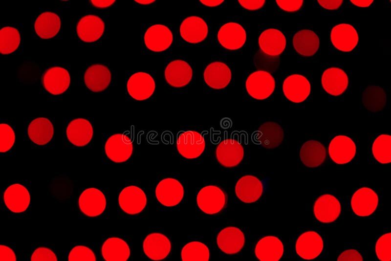 Unfocused Abstract Red Bokeh On Black Background Defocused And Blurred