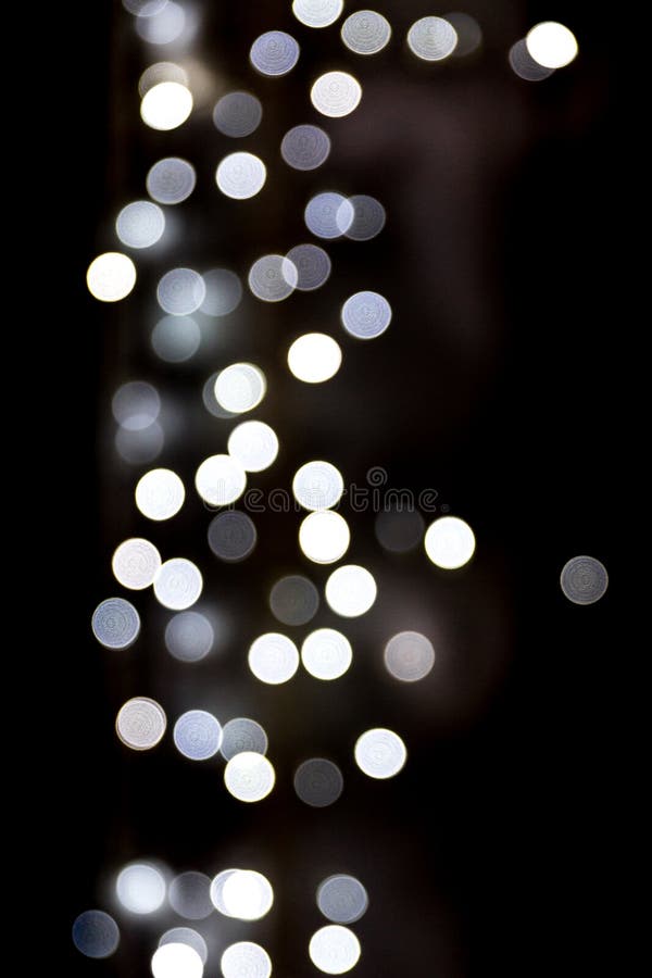Unfocused Abstract White Bokeh on Black Background. Defocused and ...