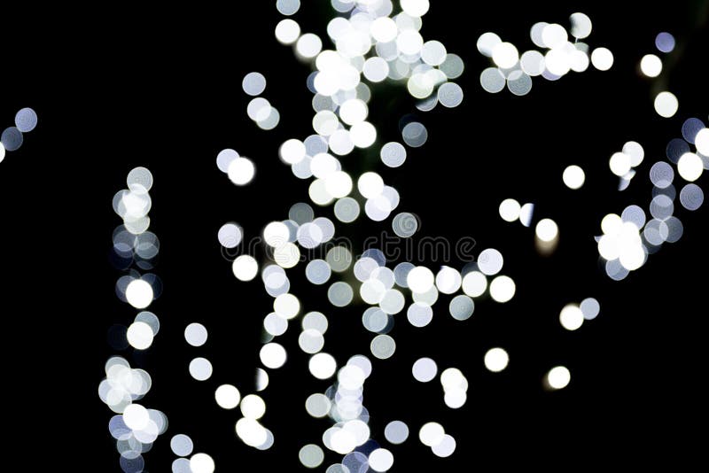 Unfocused Abstract White Bokeh on Black Background. Defocused and ...