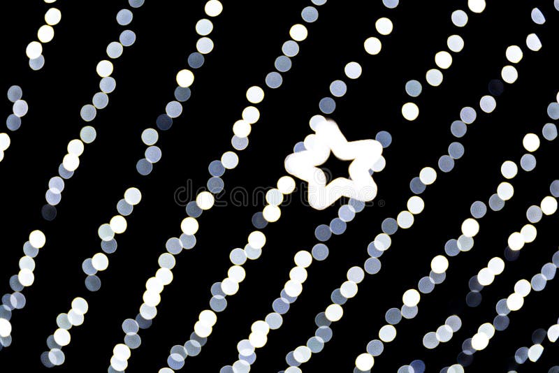 Unfocused Abstract White Bokeh with Star of Light on Black Background ...