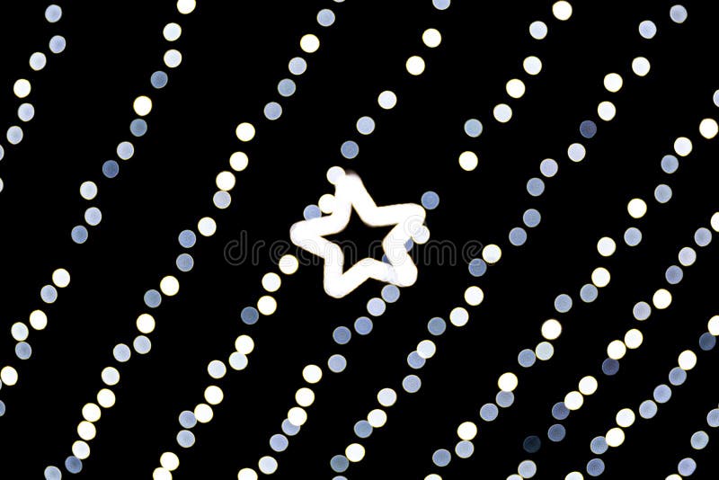 Unfocused Abstract White Bokeh with Star of Light on Black Background ...