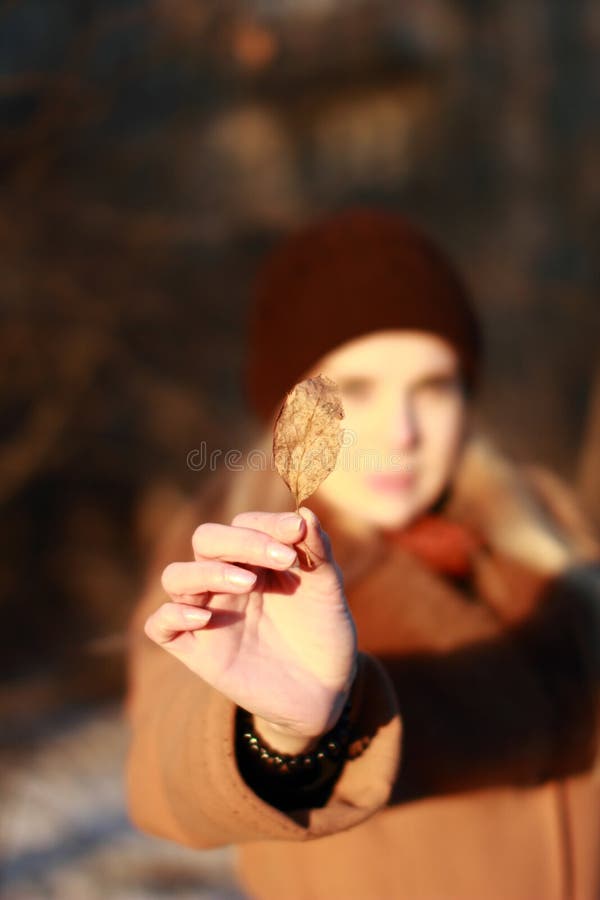 Unfocused Autumn Woman Show Leaf. Copy Space. Stock Photo - Image of ...