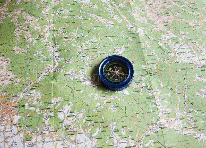 Compass on the map stock photo. Image of unfolded, macro - 146301790